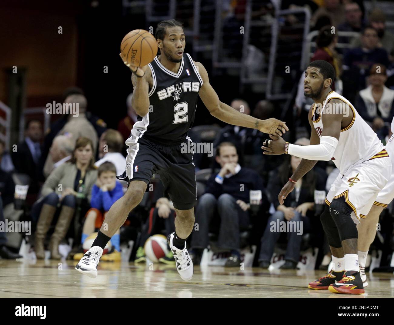 San Antonio Spurs' Kawhi Leonard (2) looks to pass away from Cleveland ...