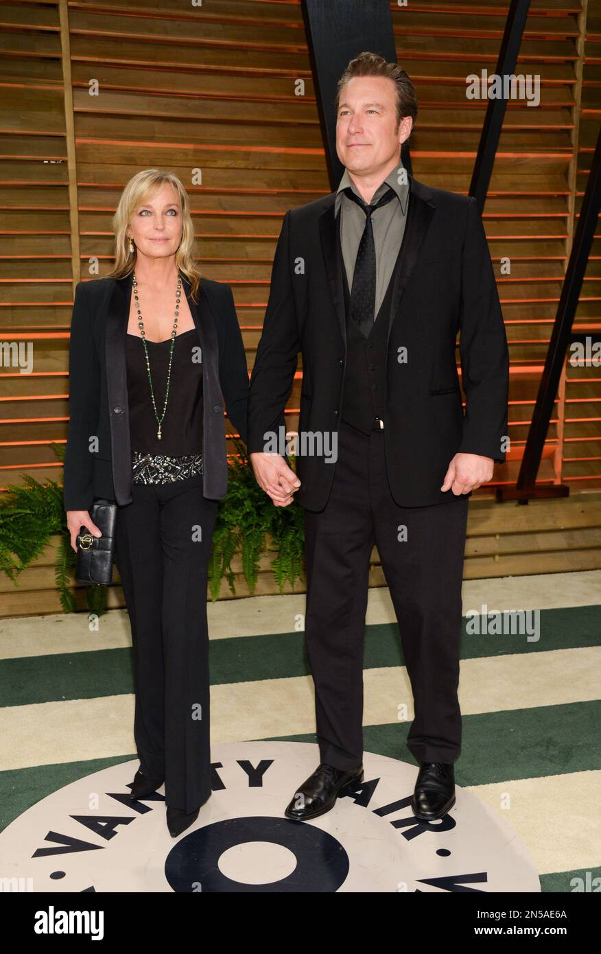 John Corbett and girlfriend Bo Derek attend the 2014 Vanity Fair Oscar Party on Sunday, March 2 ...