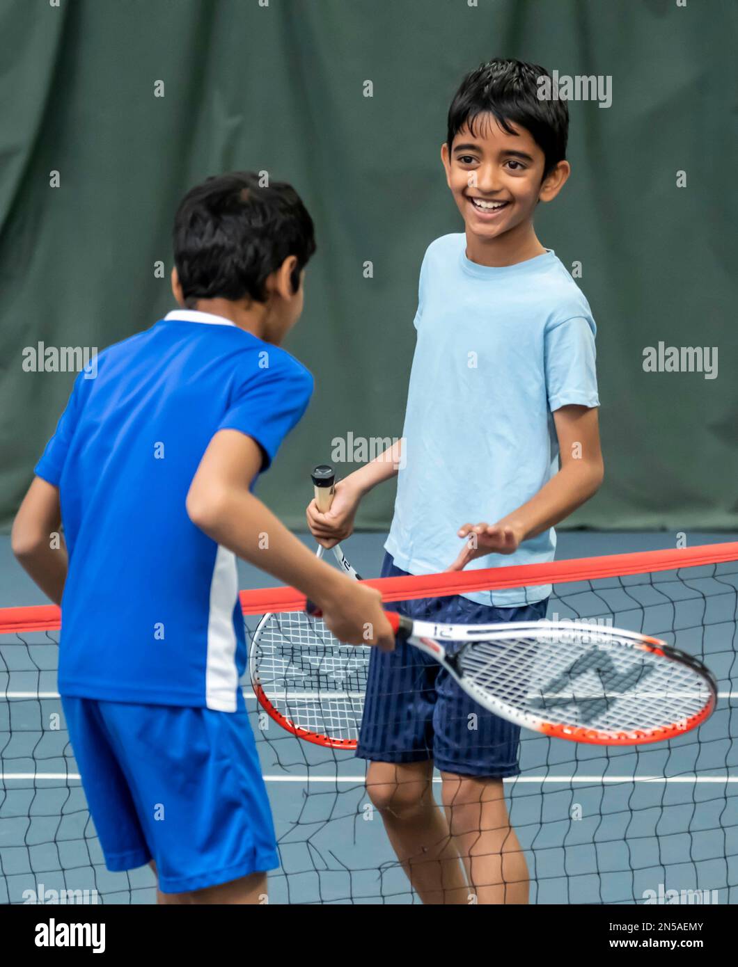 Children playing tennis and having tennis lessons Stock Photo - Alamy