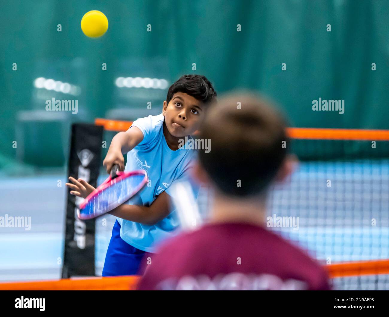 Children playing tennis and having tennis lessons Stock Photo - Alamy