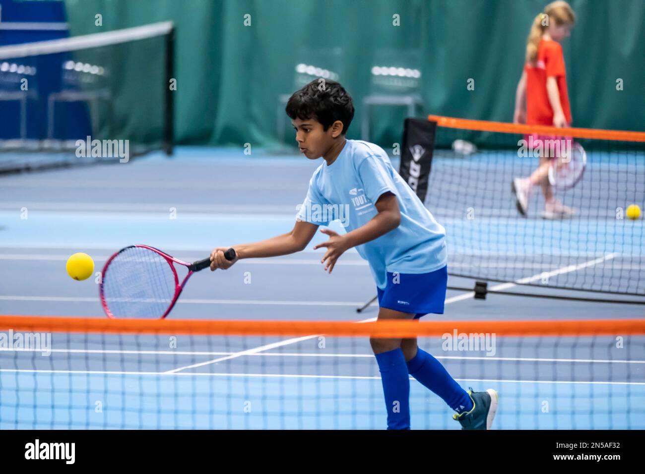 Children playing tennis and having tennis lessons Stock Photo - Alamy
