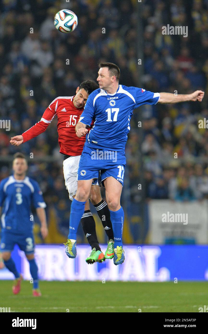 Bosnia's Samir Muratovic right, and Egypt's Gedo challenge for the ball ...
