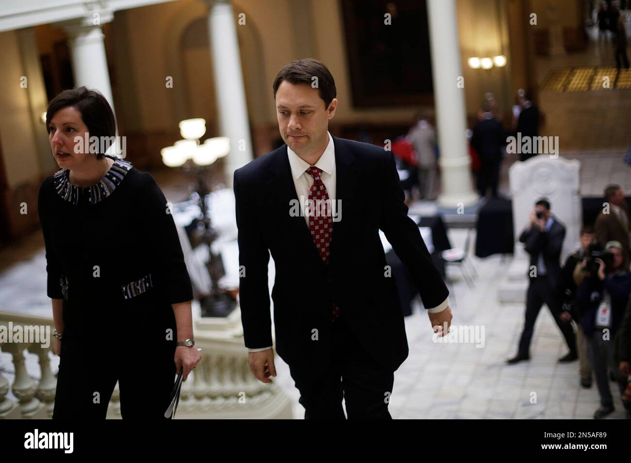 Georgia Sen. Jason Carter, D-Decatur, right, climbs the stairs of the ...