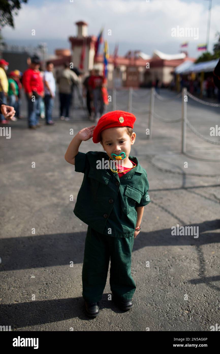 Kliver Zambrano, 2, wearing a uniform and red beret in honor of the ...
