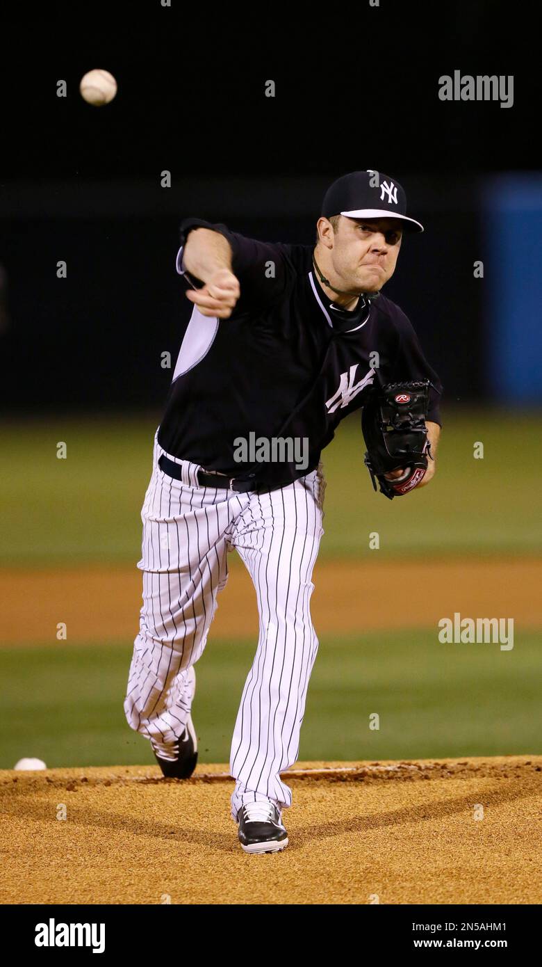 New York Yankees starting pitcher David Phelps throws a pitch during ...