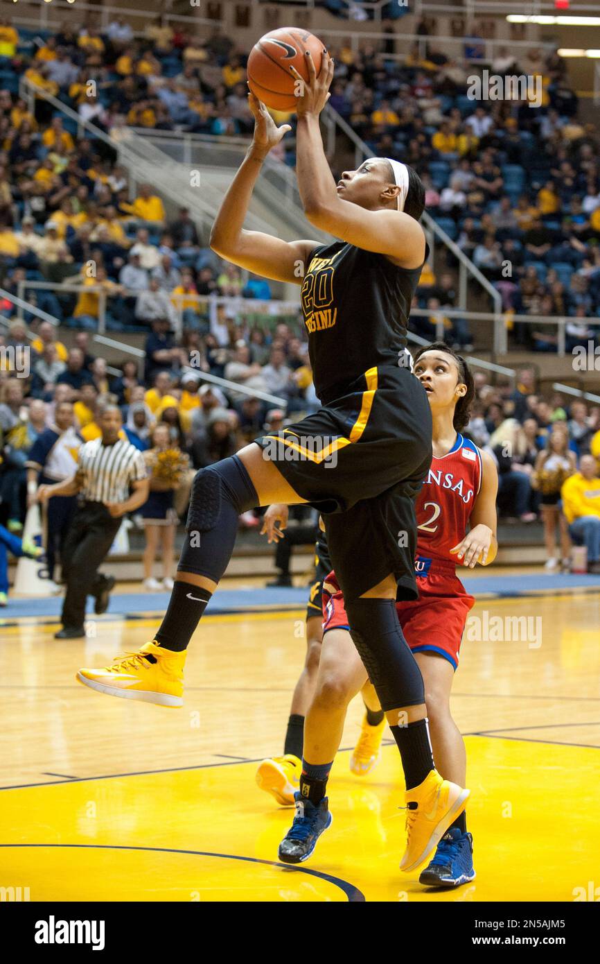 West Virginia's Asya Bussie (20) drives to the basket during the first ...