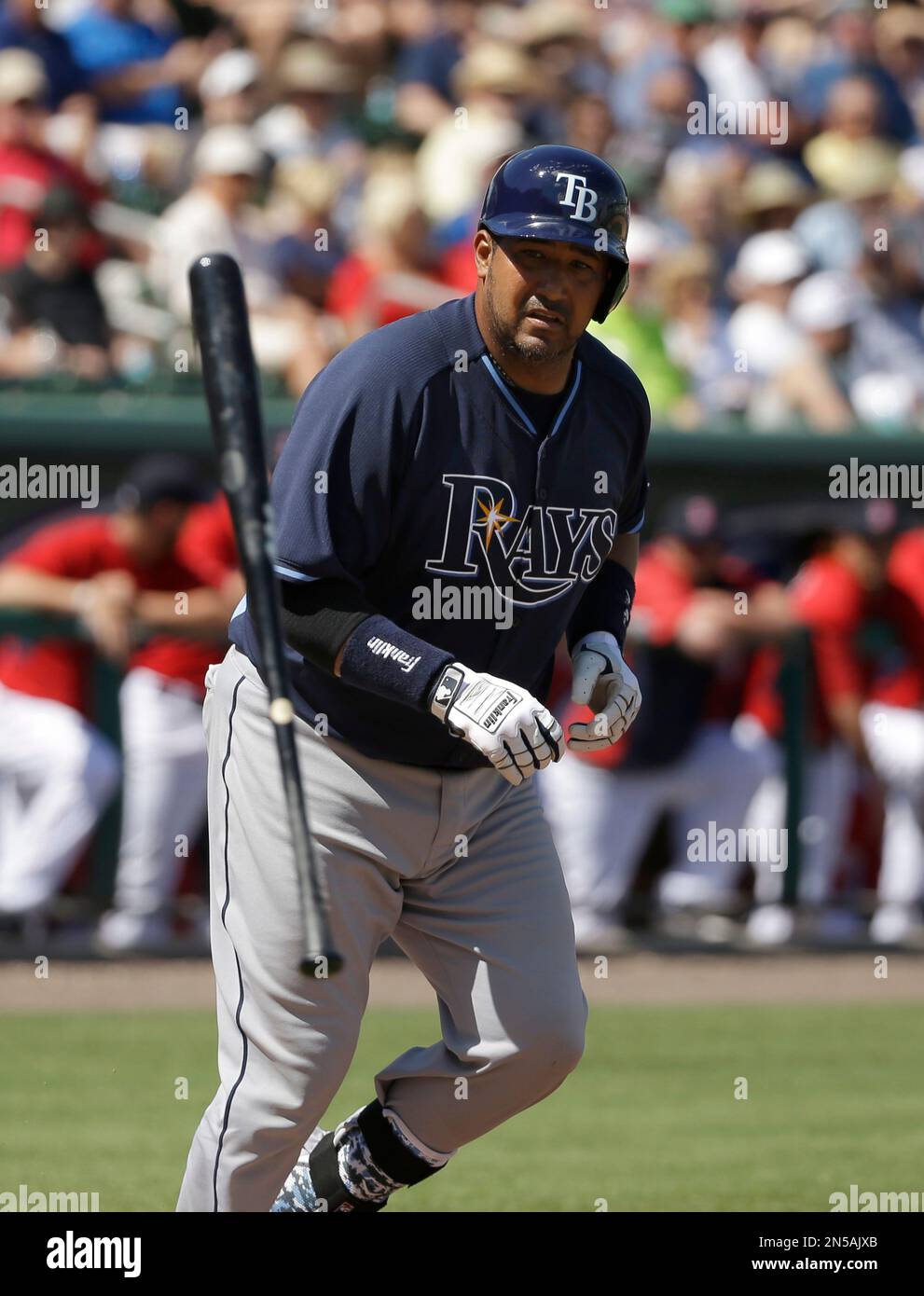Tampa Bay Rays' Jose Molina sets the bat down as he is walked by Boston Red Sox pitcher Rubby De ...