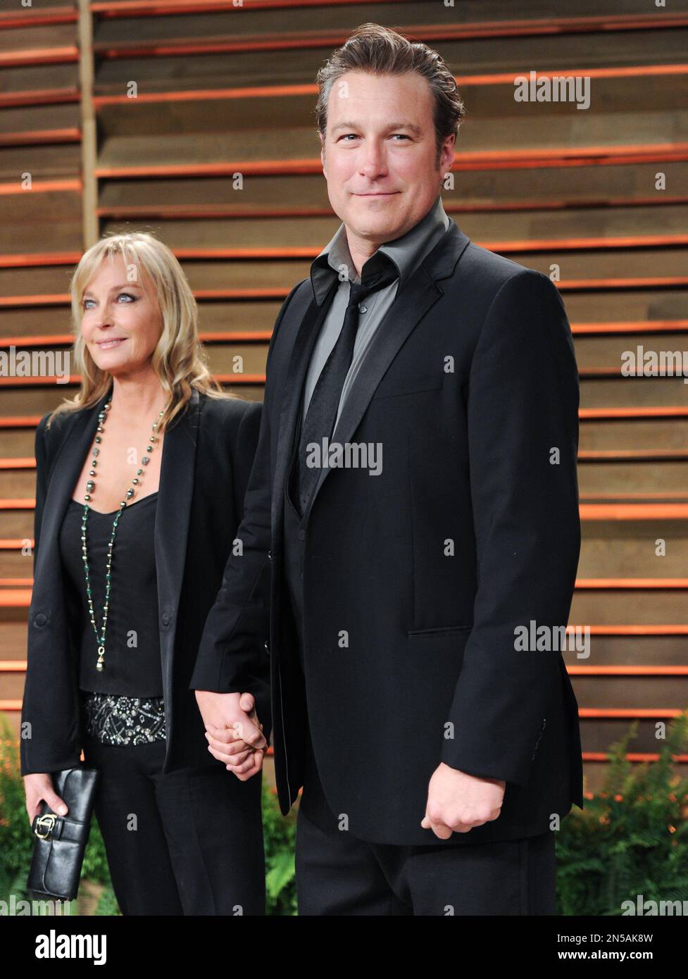 John Corbett and girlfriend Bo Derek attend the 2014 Vanity Fair Oscar Party, on Sunday, March 2 ...
