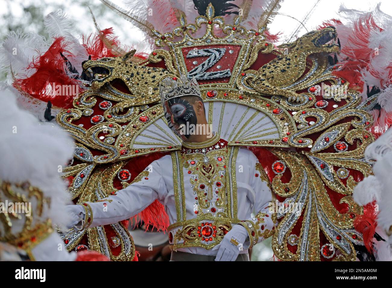 Garren Thomas Mims Sr., King of the Krewe of Zulu, rides his float ...