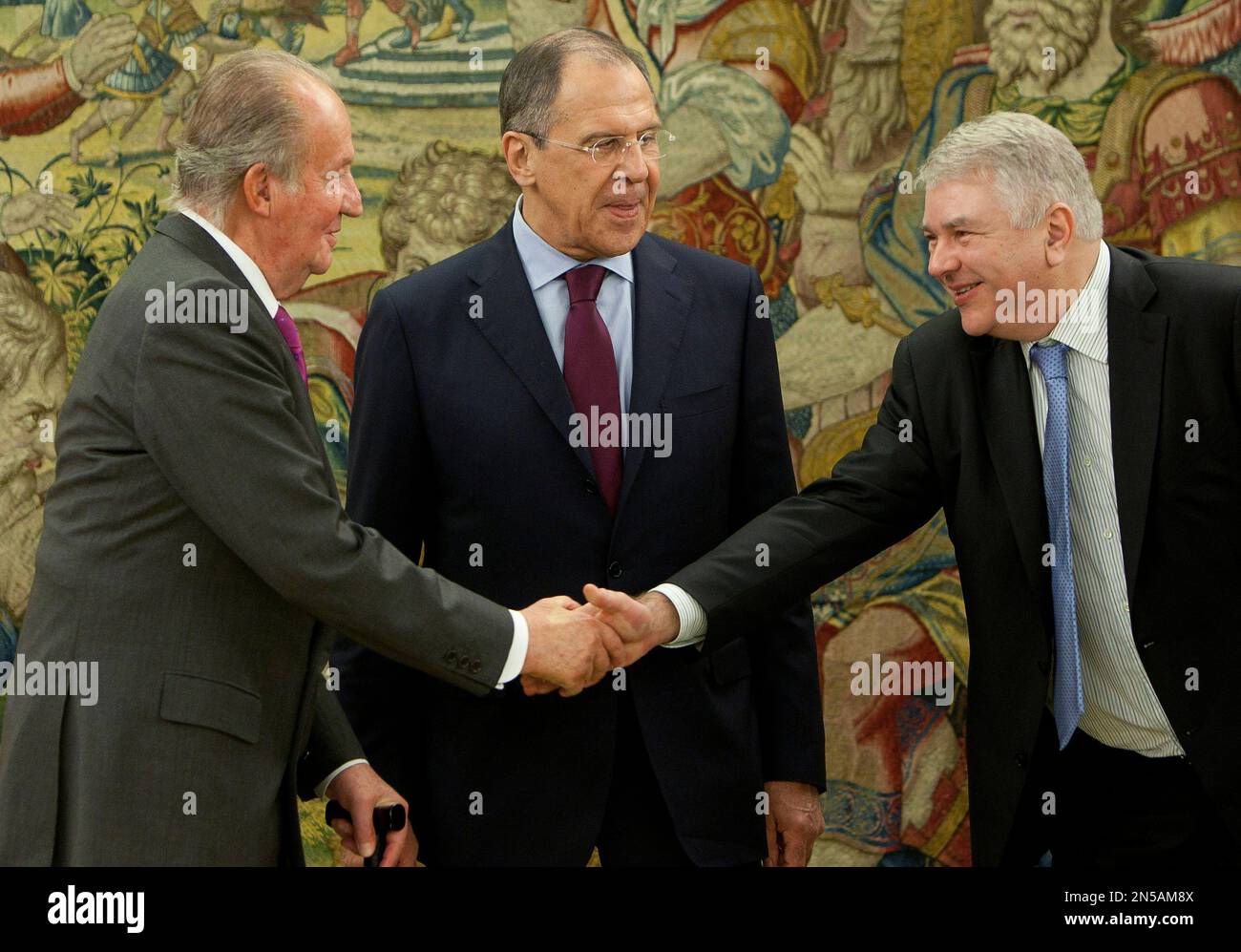 Spain's King Juan Carlos, left, shakes hands with Russian Deputy ...