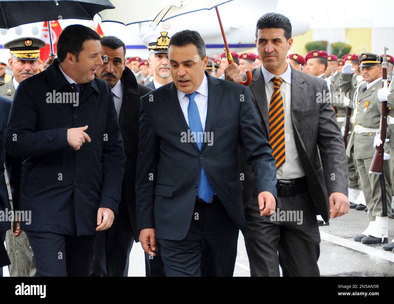 Tunisian Prime Minister, Mehdi Jomaa, 2nd right, greets his Italian ...