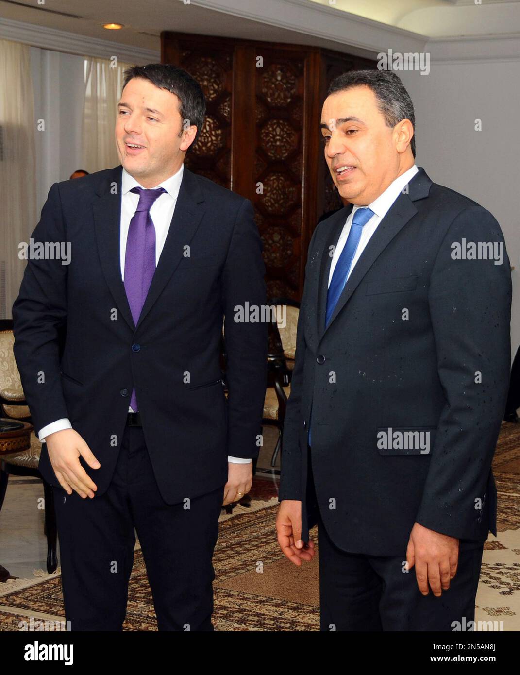 Tunisian Prime Minister, Mehdi Jomaa, 2nd right, greets his Italian ...