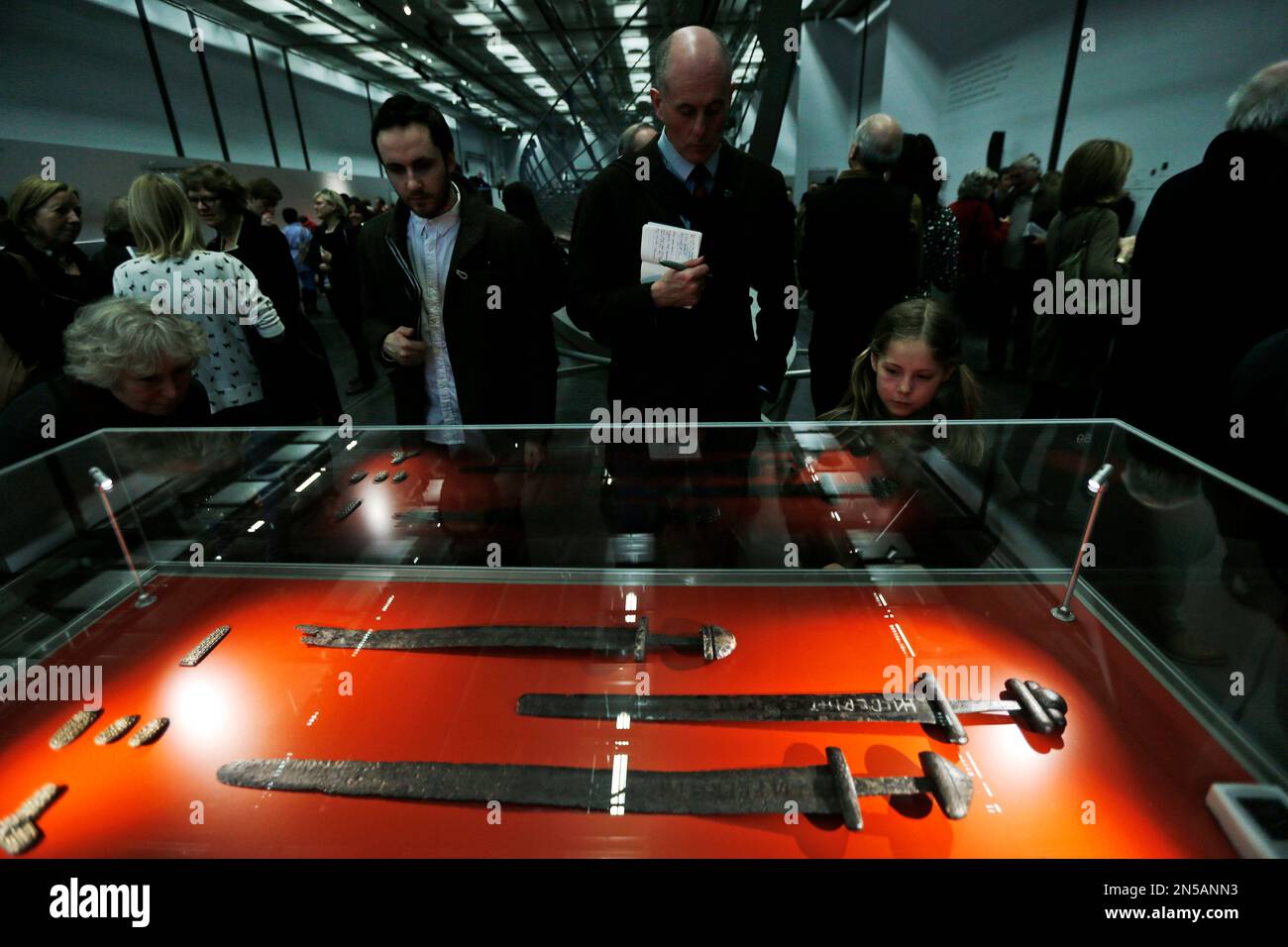 Visitors looks at Viking swords at a new exhibition entitled 'Vikings ...