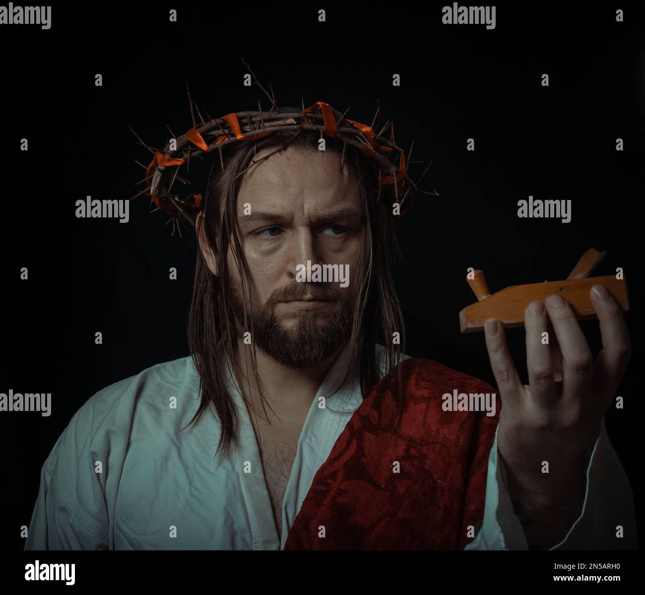 Jesus Christ wearing a crown of thorns and white chiton toga mantle ...