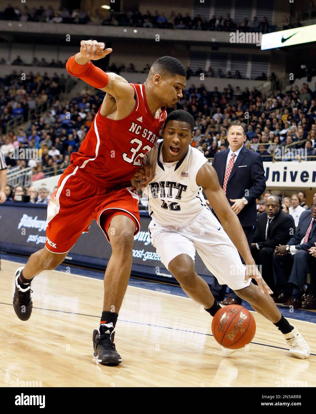 North Carolina State's Kyle Washington (32) fouls Pittsburgh's Chris ...