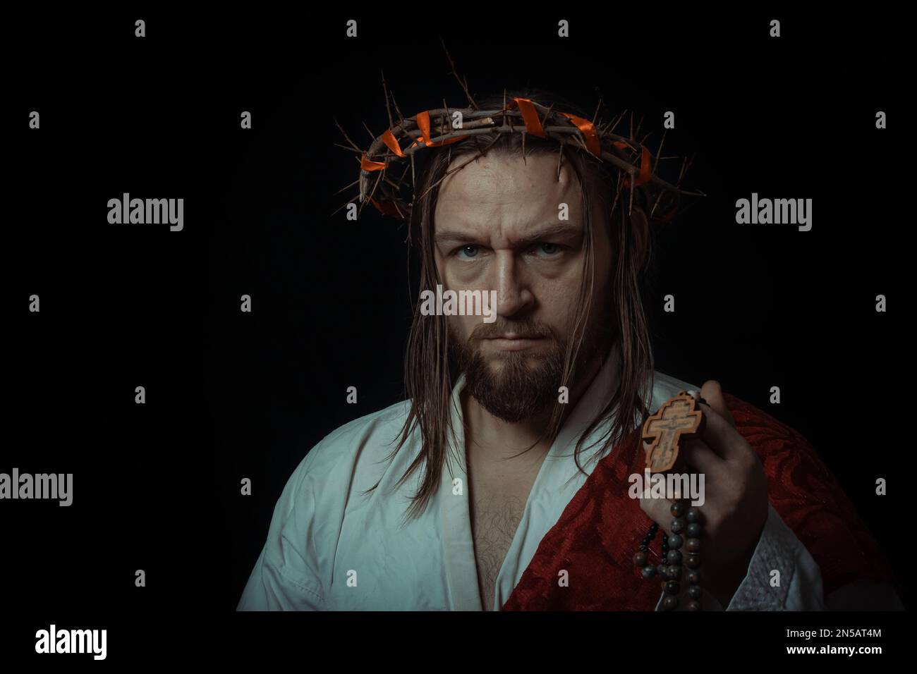 Jesus Christ wearing a crown of thorns and white chiton toga mantle ...