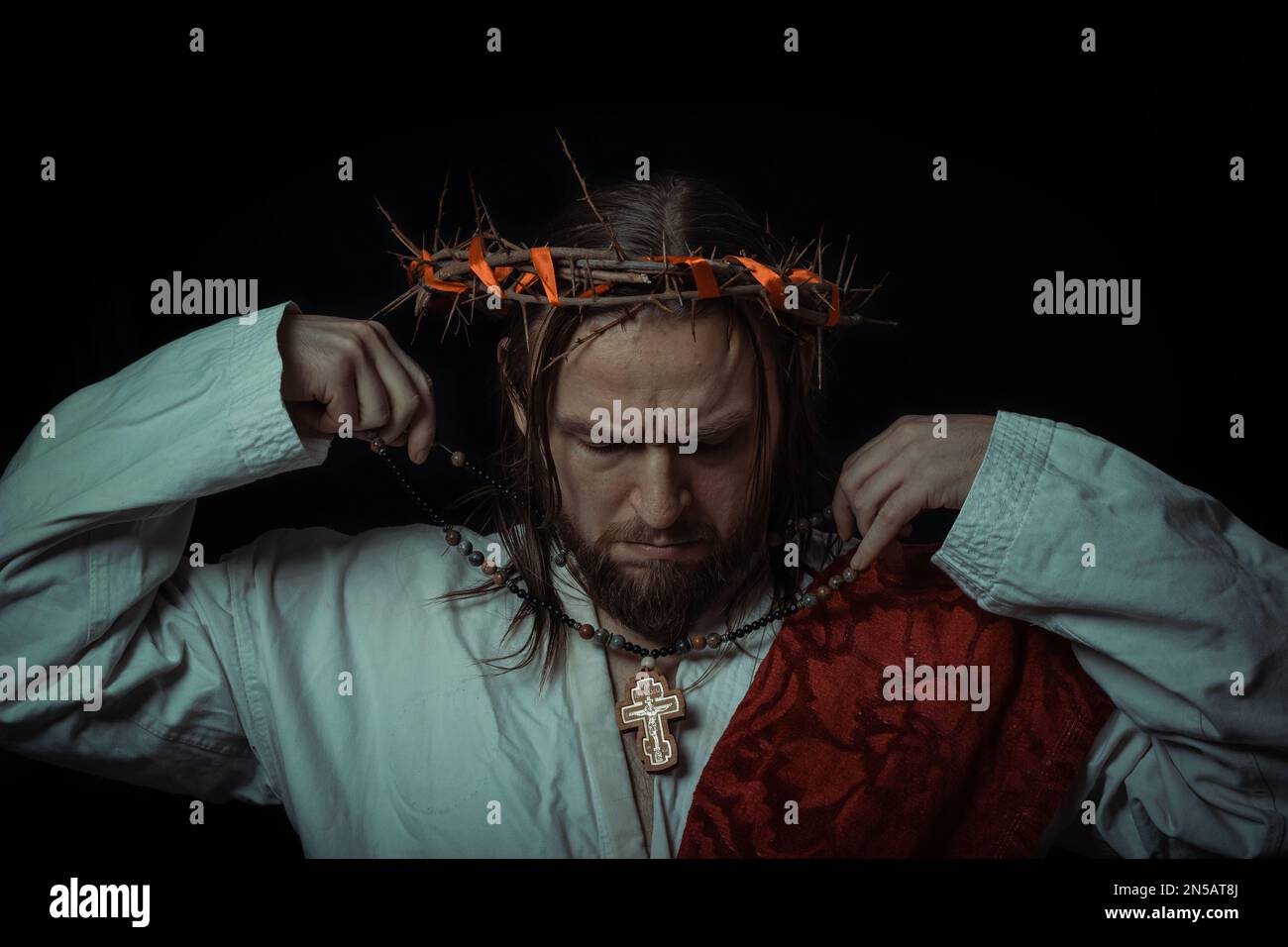 Jesus Christ wearing a crown of thorns and white chiton toga mantle ...