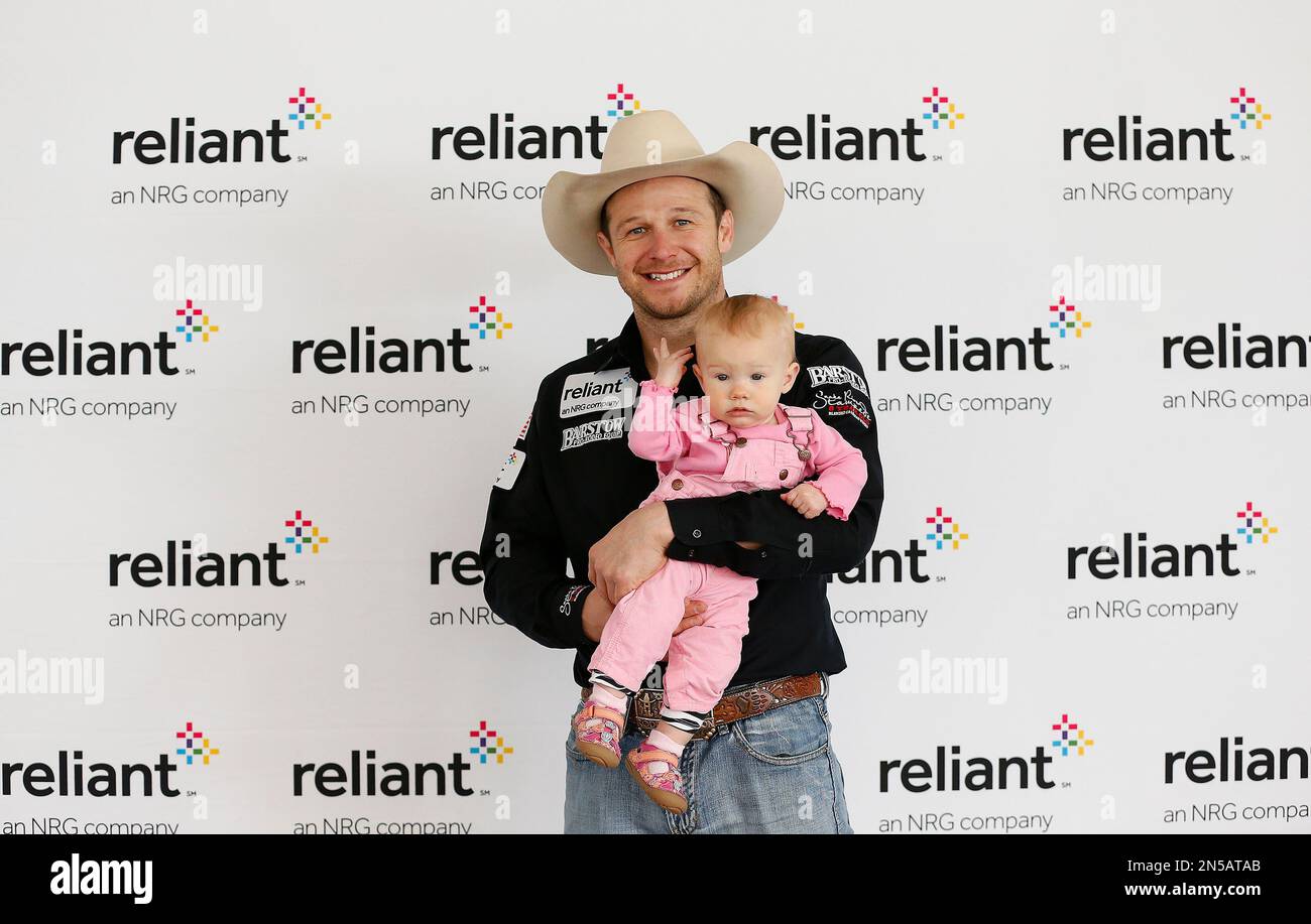 Clint Cannon, professional bareback rider, and his baby daughter ...