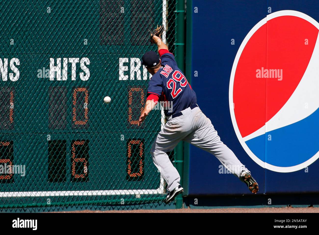Boston Red Sox left fielder Daniel Nava (29) can't reach a ball hit by ...