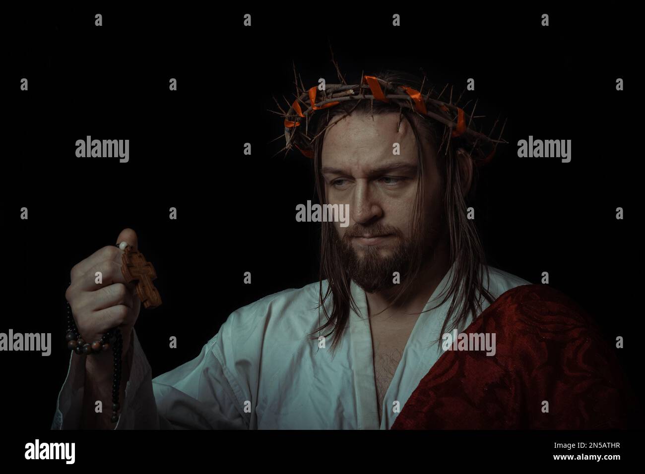 Jesus Christ wearing a crown of thorns and white chiton toga mantle ...