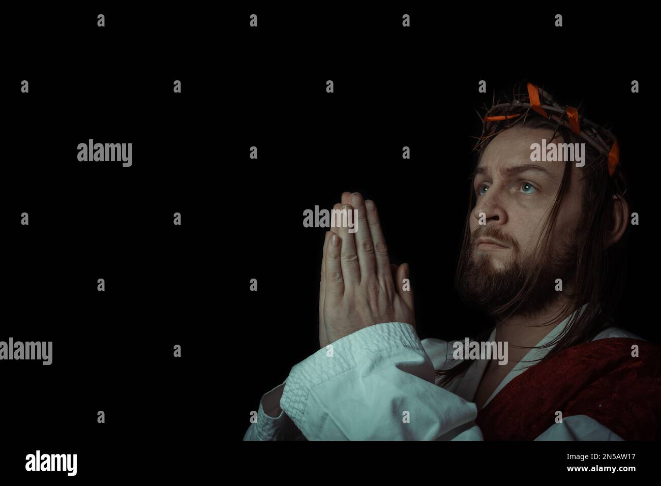 Jesus Christ wearing a crown of thorns and white chiton toga mantle ...