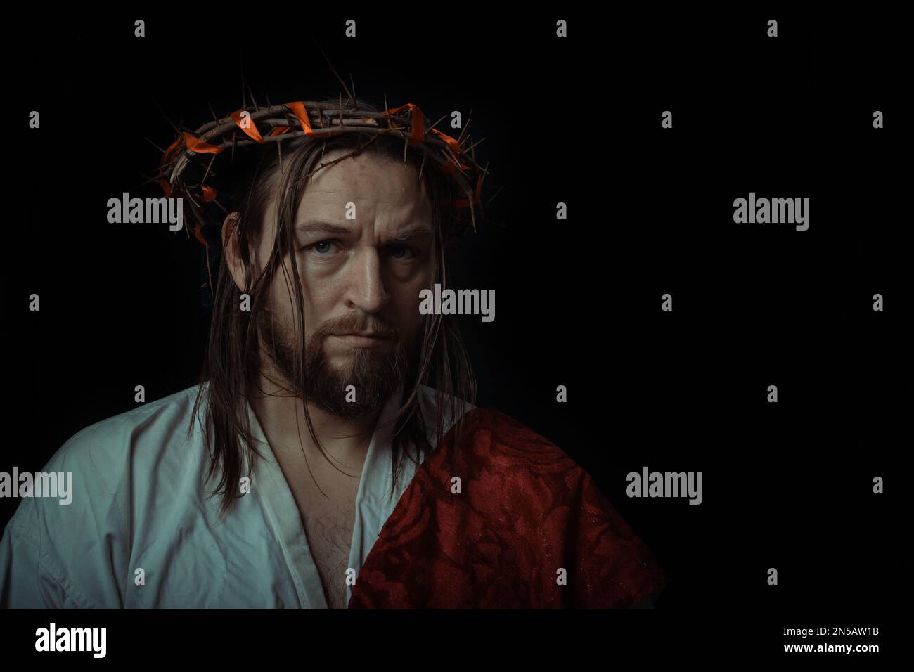 Jesus Christ wearing a crown of thorns and white chiton toga mantle ...