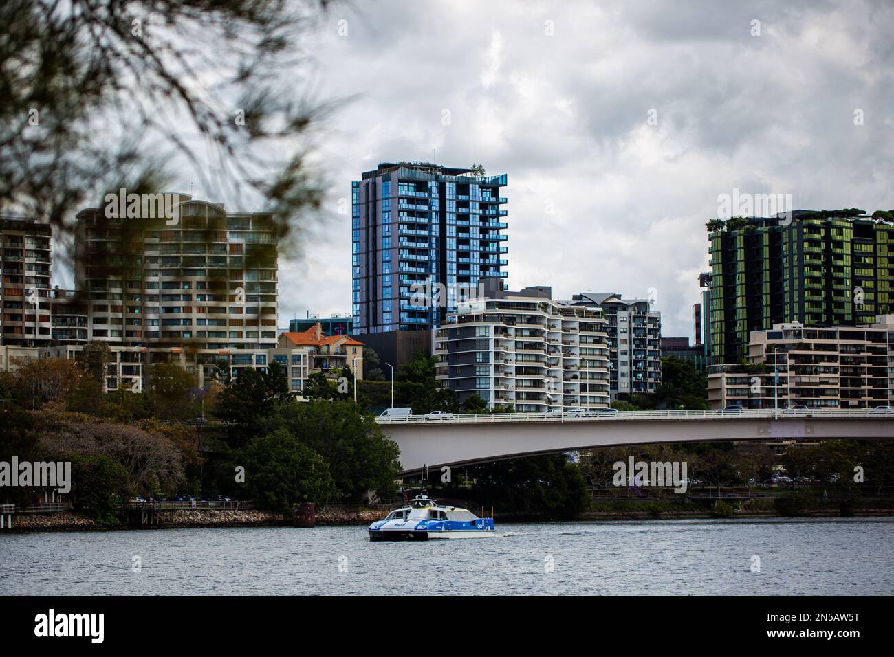 A boat on the river Brisbane with the city in the background ...
