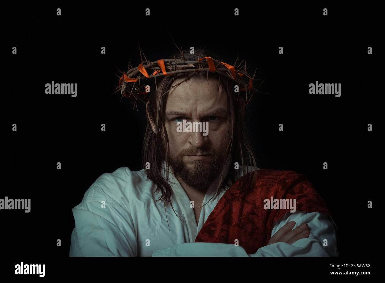 Jesus Christ wearing a crown of thorns and white chiton toga mantle ...