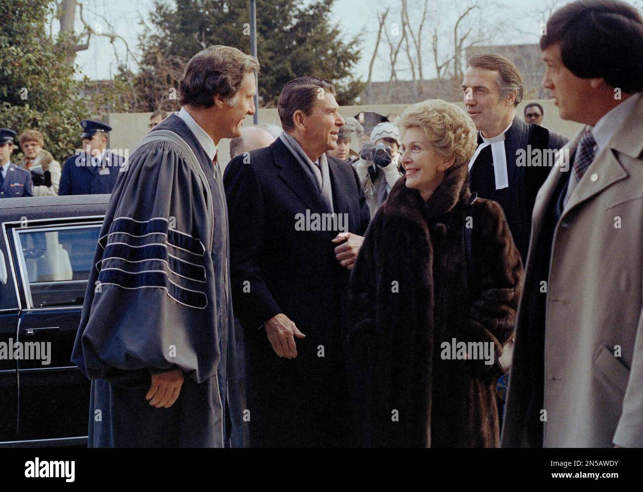 President-elect Ronald Reagan and wife Nancy Reagan are greeted by Rev ...