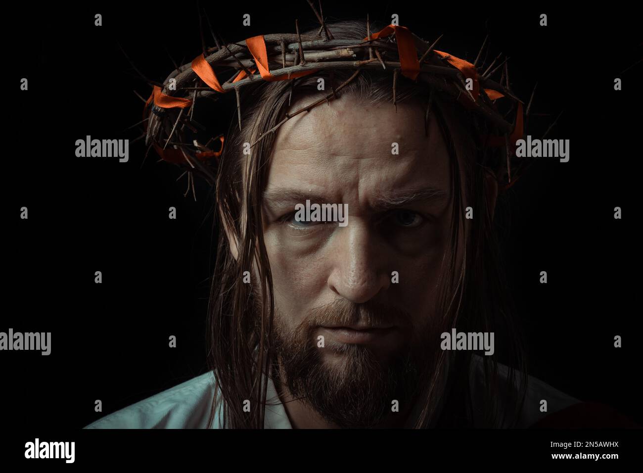 Jesus Christ wearing a crown of thorns and white chiton toga mantle ...