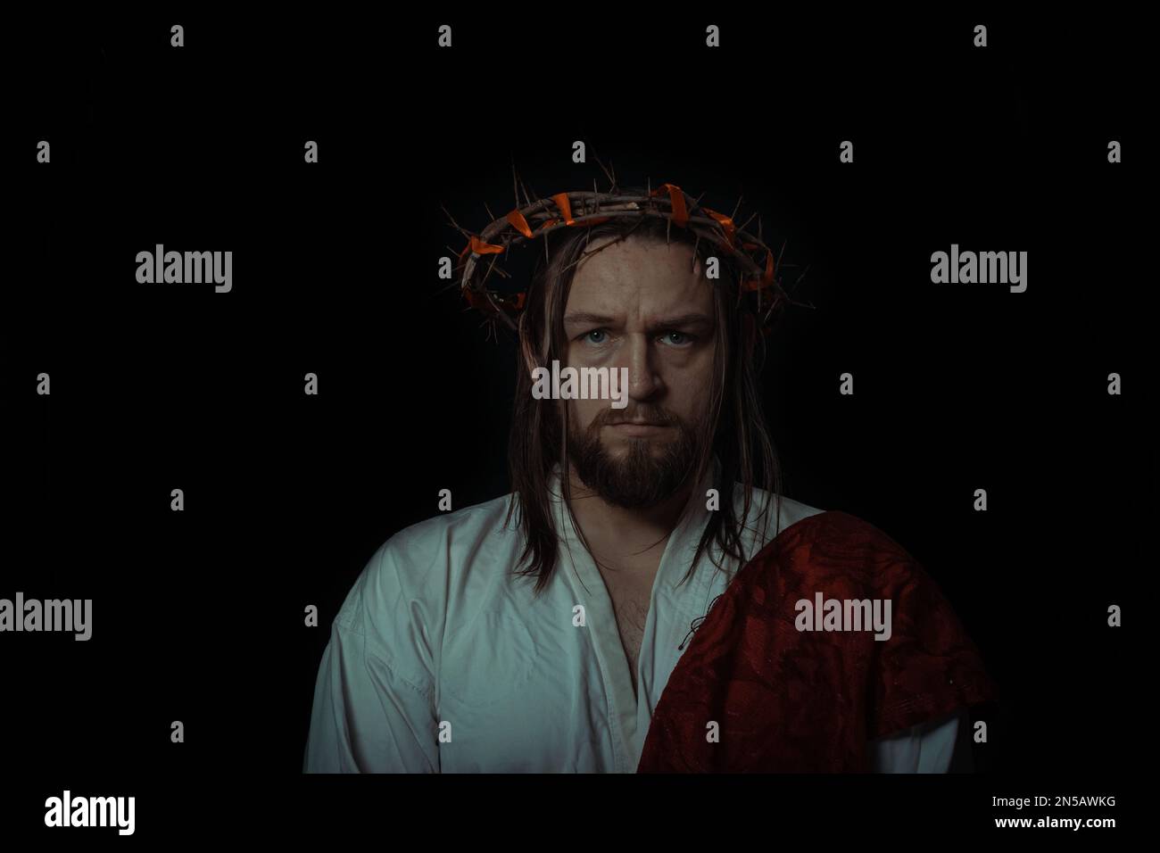 Jesus Christ wearing a crown of thorns and white chiton toga mantle ...