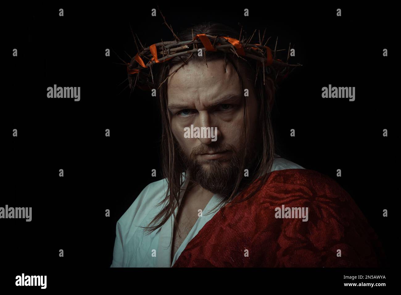 Jesus Christ wearing a crown of thorns and white chiton toga mantle ...