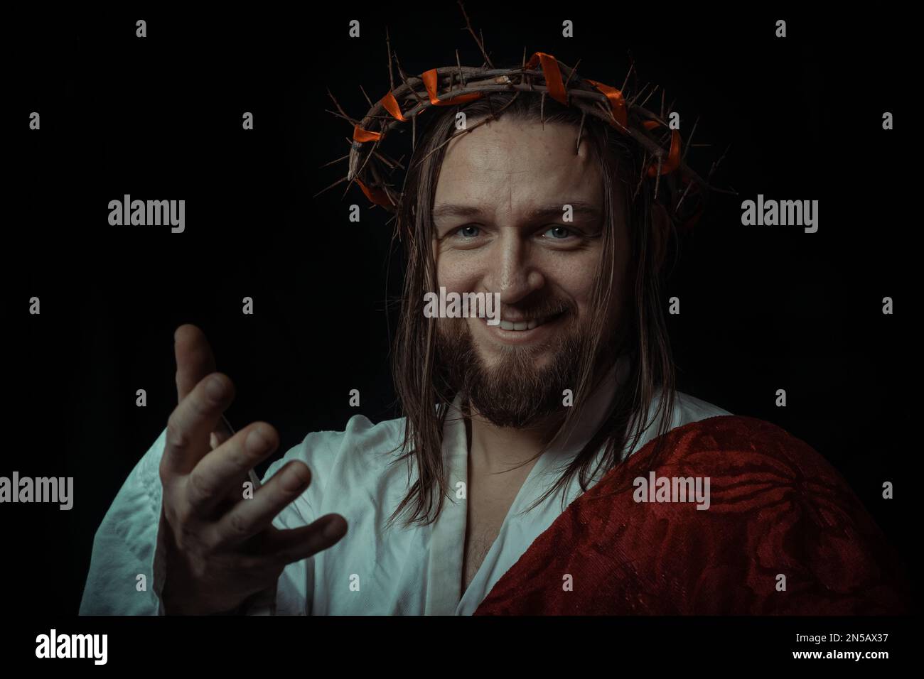 Jesus Christ wearing a crown of thorns and white chiton toga mantle ...