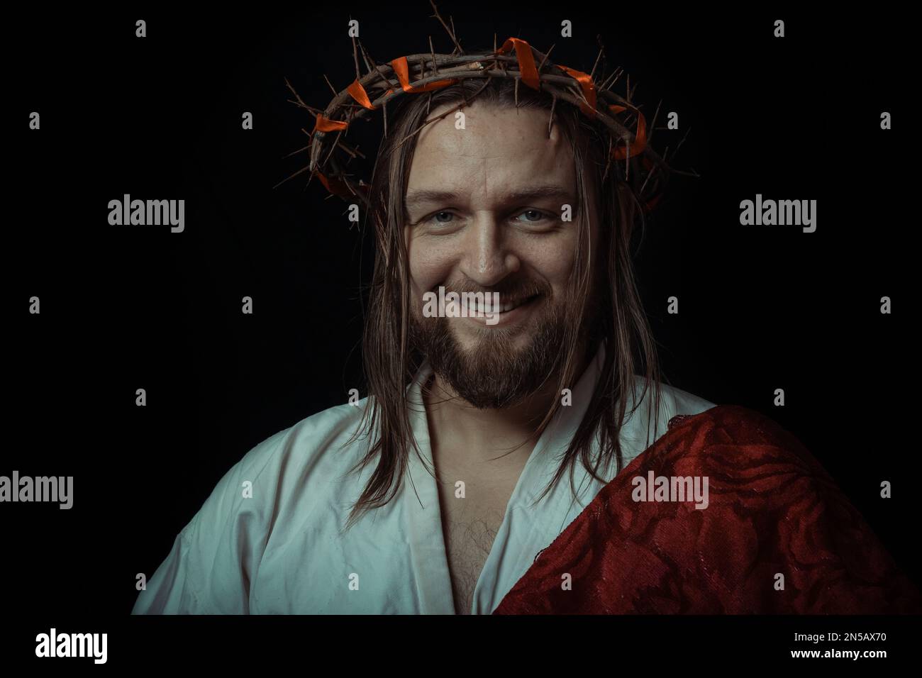 Jesus Christ wearing a crown of thorns and white chiton toga mantle ...
