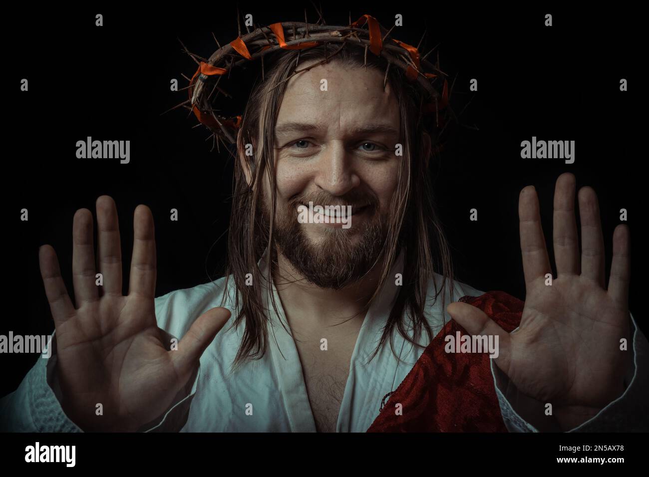 Jesus Christ wearing a crown of thorns and white chiton toga mantle ...