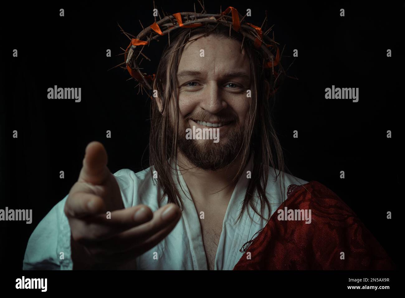 Jesus Christ wearing a crown of thorns and white chiton toga mantle ...