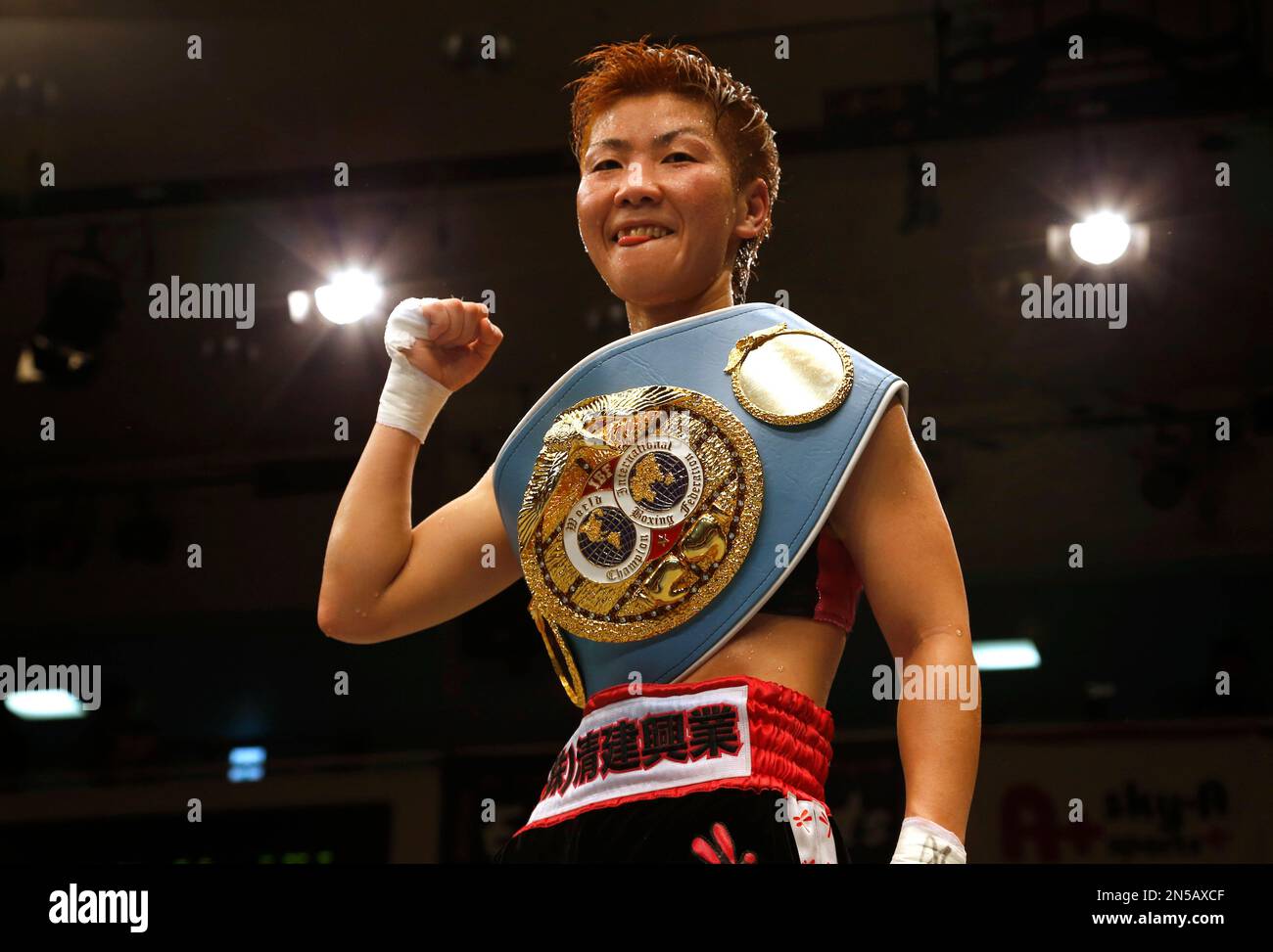 Japanese champion Naoka Shibata wearing her champion belt poses for ...
