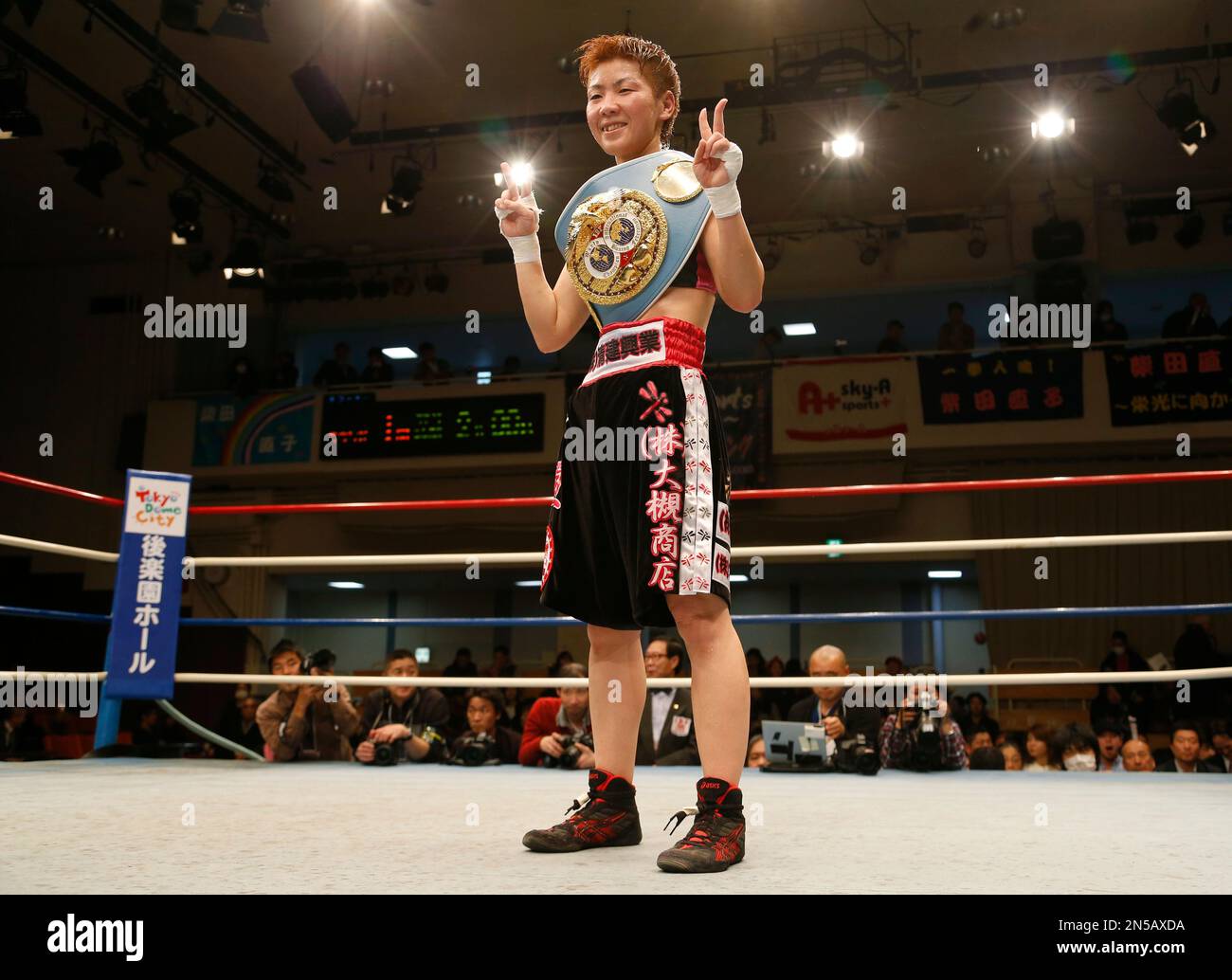 Japanese champion Naoka Shibata wearing her champion belt poses for ...