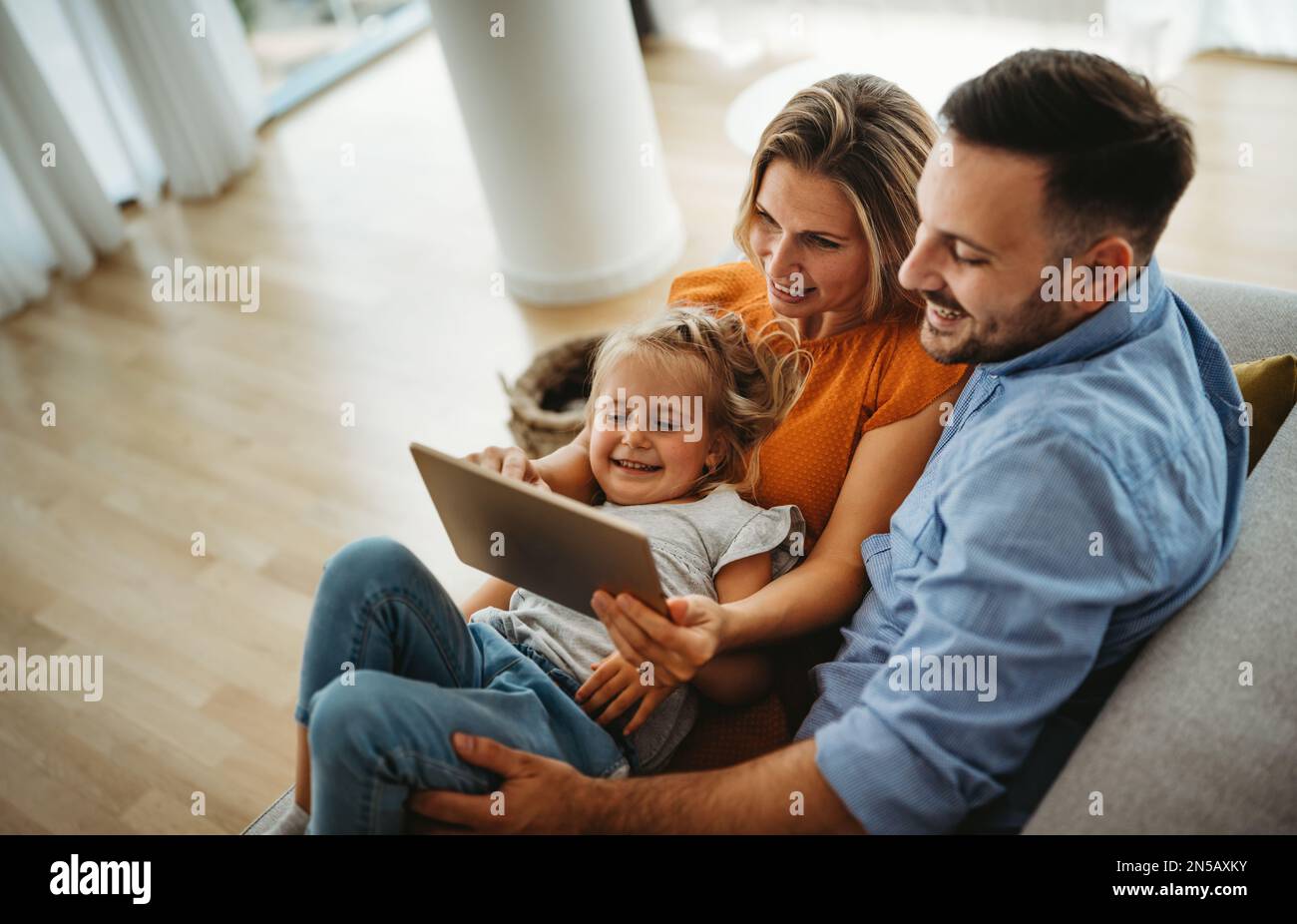 Device technology family online education concept. Happy family with ...