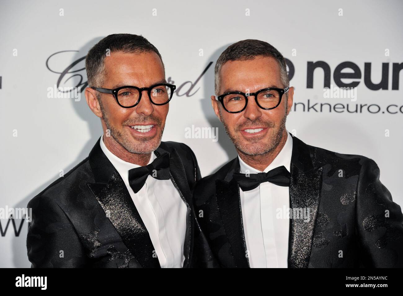 Dean Caten, left, and Dan Caten arrive at 2014 Elton John Oscar Viewing ...