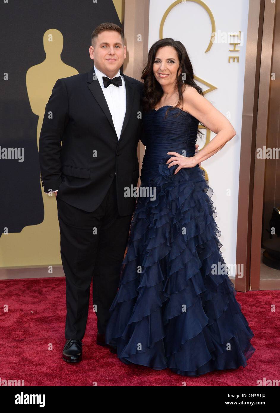 Jonah Hill, left, and Sharon Lyn Chalkin arrives at the Oscars on ...