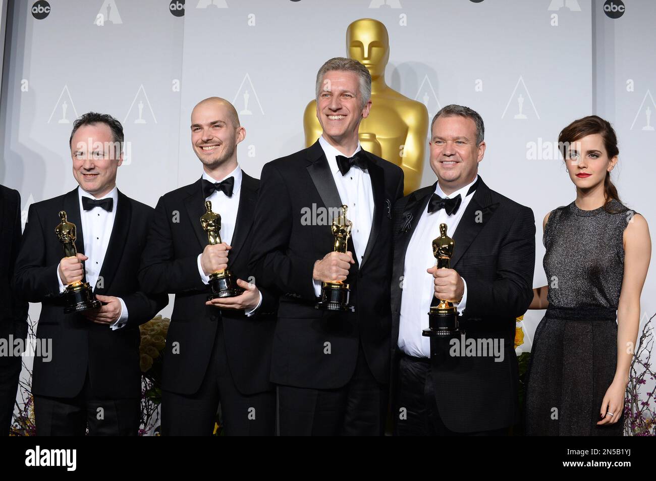 Presenter Emma Watson, right, poses with Tim Webber, David Shirk, Chris ...