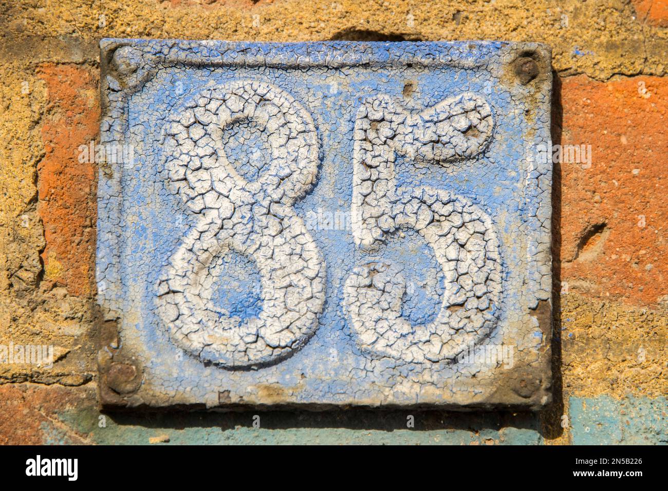Old retro weathered cast iron plate with number 85 Stock Photo - Alamy