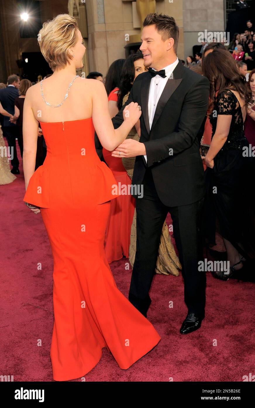 Jennifer Lawrence, left, and Channing Tatum arrive at the Oscars on ...