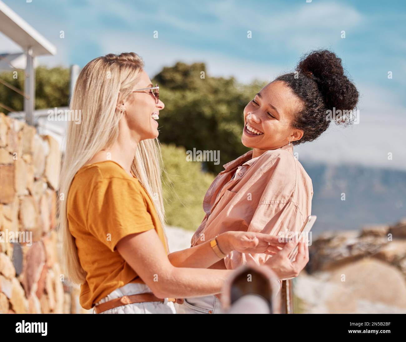 Diversity, happy or friends laughing to relax while speaking or talking ...