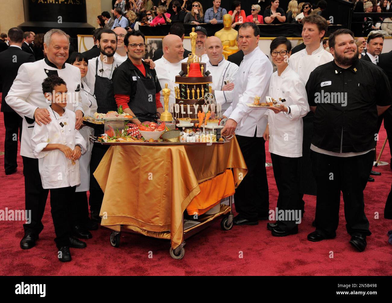Wolfgang Puck, left, and his son Oliver Wolfgang Puck cut a cake at the ...
