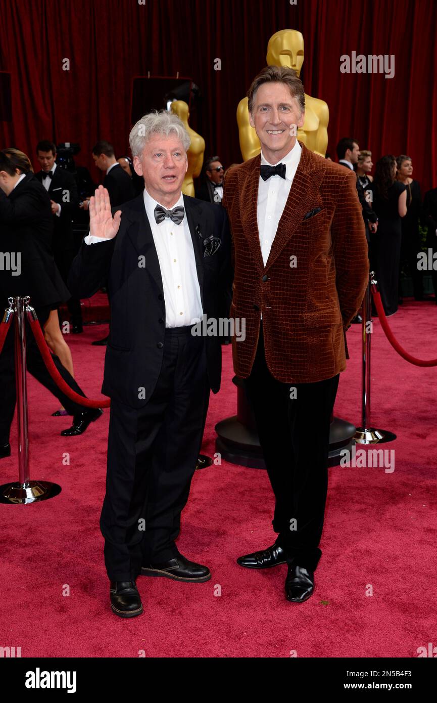 Malcolm Clarke, left, and Nicholas Reed arrive at the Oscars on Sunday, March 2, 2014, at the ...