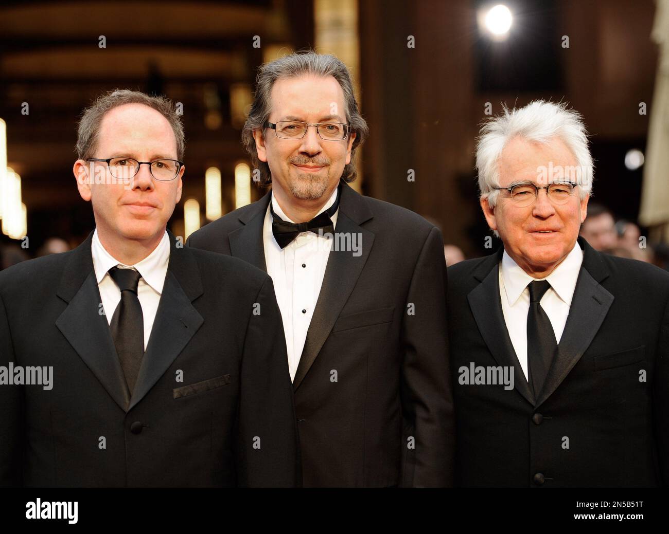 Albert Berger, from left, Bob Nelson and Ron Yerxa arrive at the Oscars ...