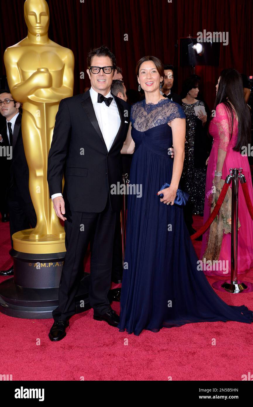 Johnny Knoxville, left, and Naomi Nelson arrive at the Oscars on Sunday ...
