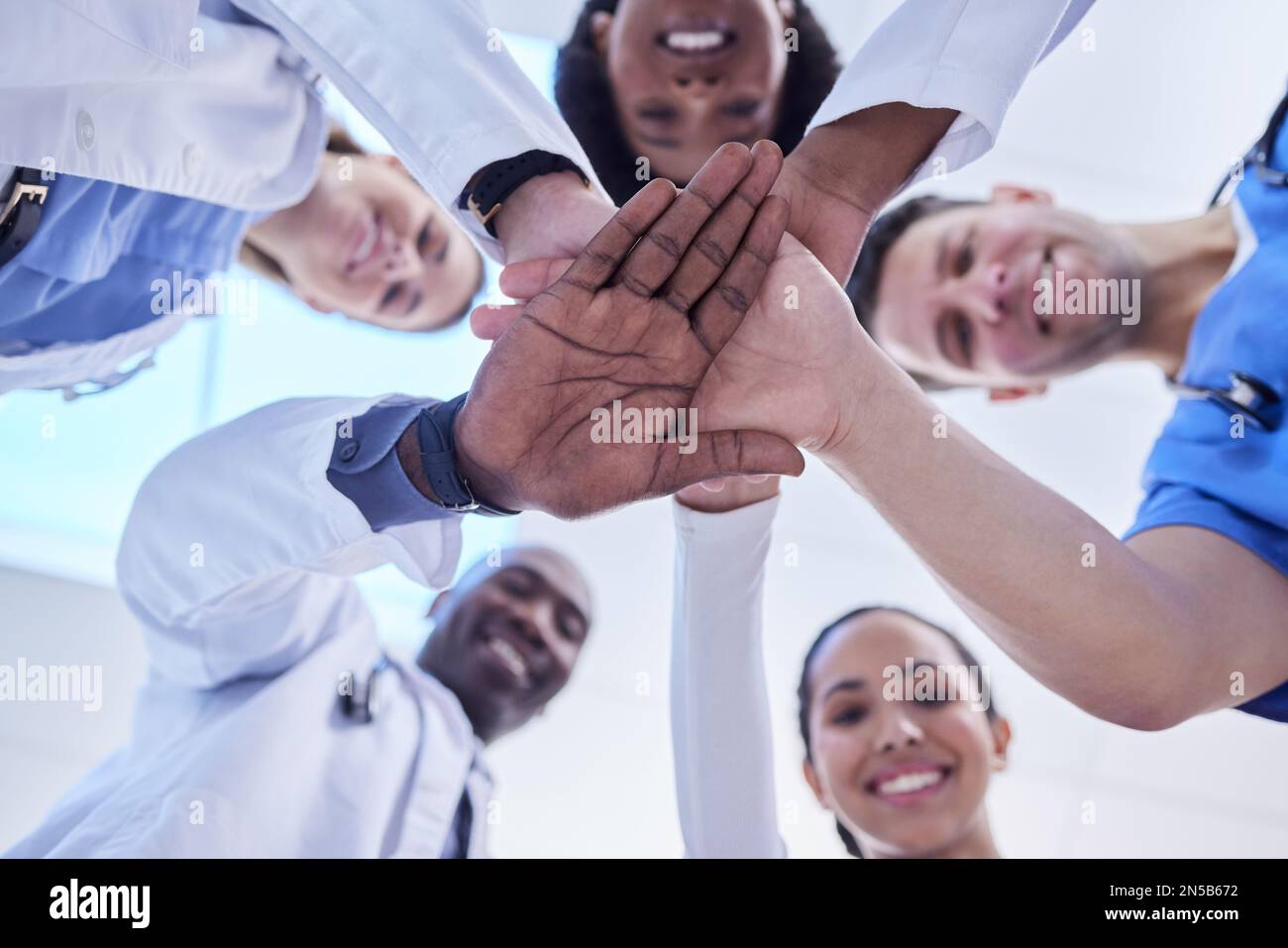 Healthcare, teamwork and hands together in huddle for team building, collaboration and ...